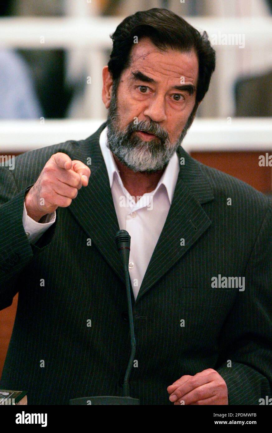 Saddam Hussein speaks to the Presiding Judge Rizgar Mohammed Amin ...