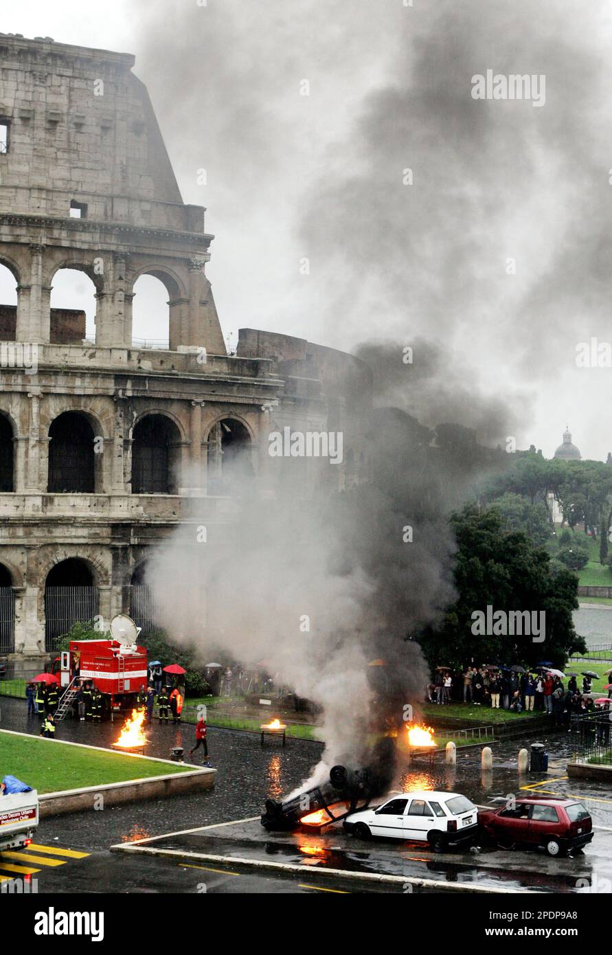 Cars burn during a simulated suicide bombing terrorist attack in front ...