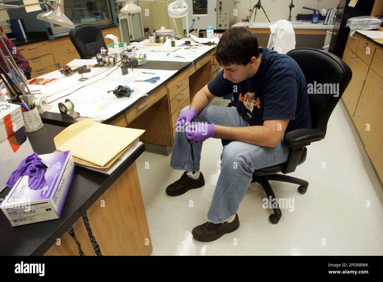 Chad Day, fingerprint examiner for the state crime lab in Cheyenne ...