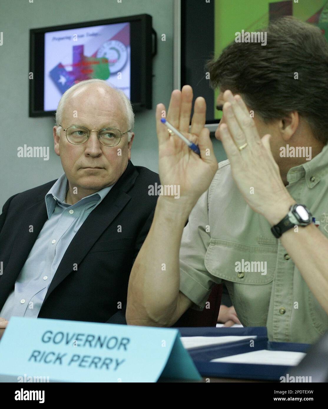Vice President Dick Cheney, left, listens as Texas Gov. Rick Perry ...