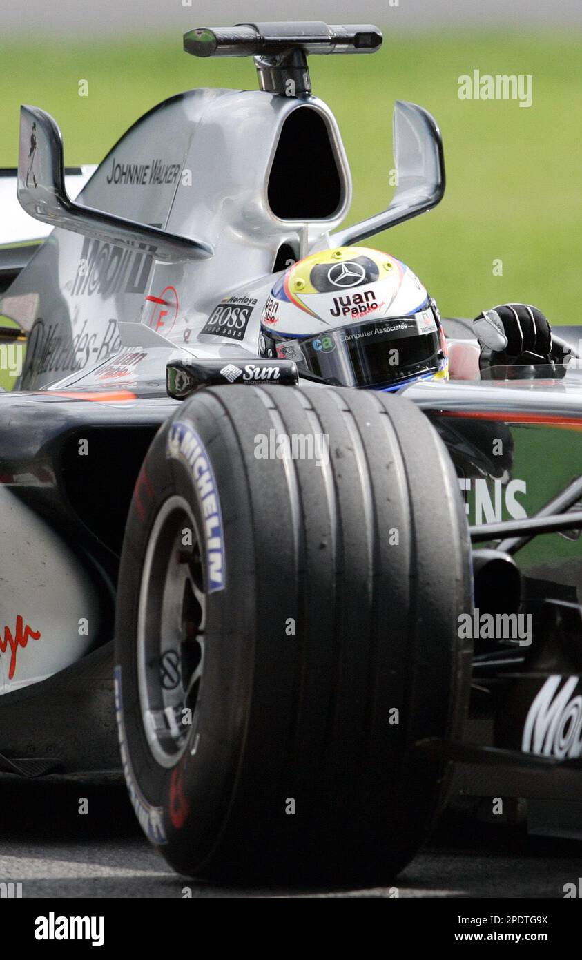 Colombia's Juan Pablo Montoya of the McLaren team drives his car into a ...