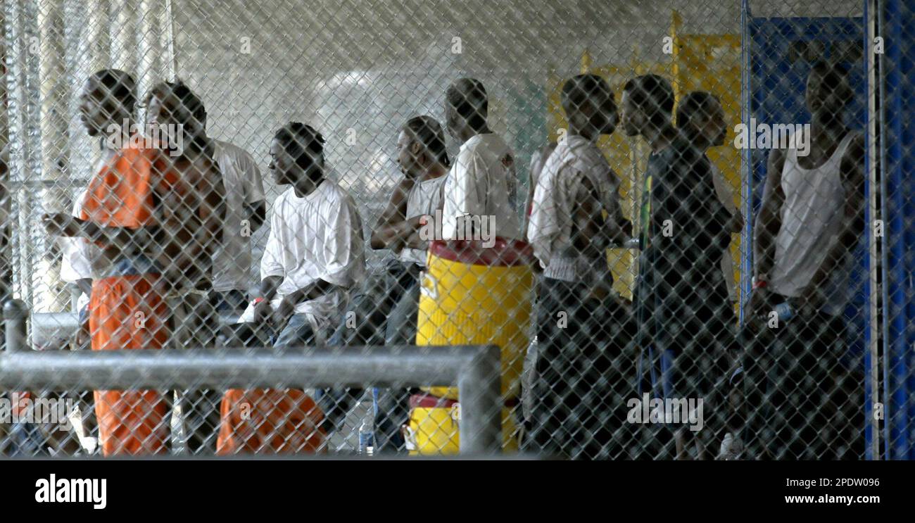 Prisoners are seen in a holding cell in New Orleans temporary jail ...