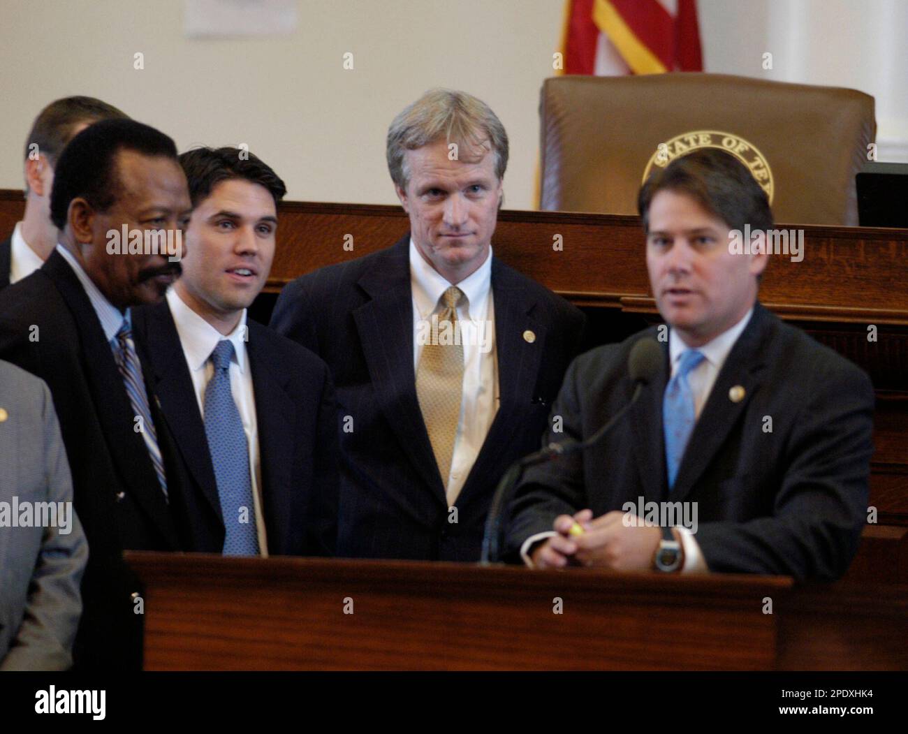 Rep. Todd Baxter, R-Austin, right, honors Rep. Terry Keel, R-Austin, center, with a resolution ...