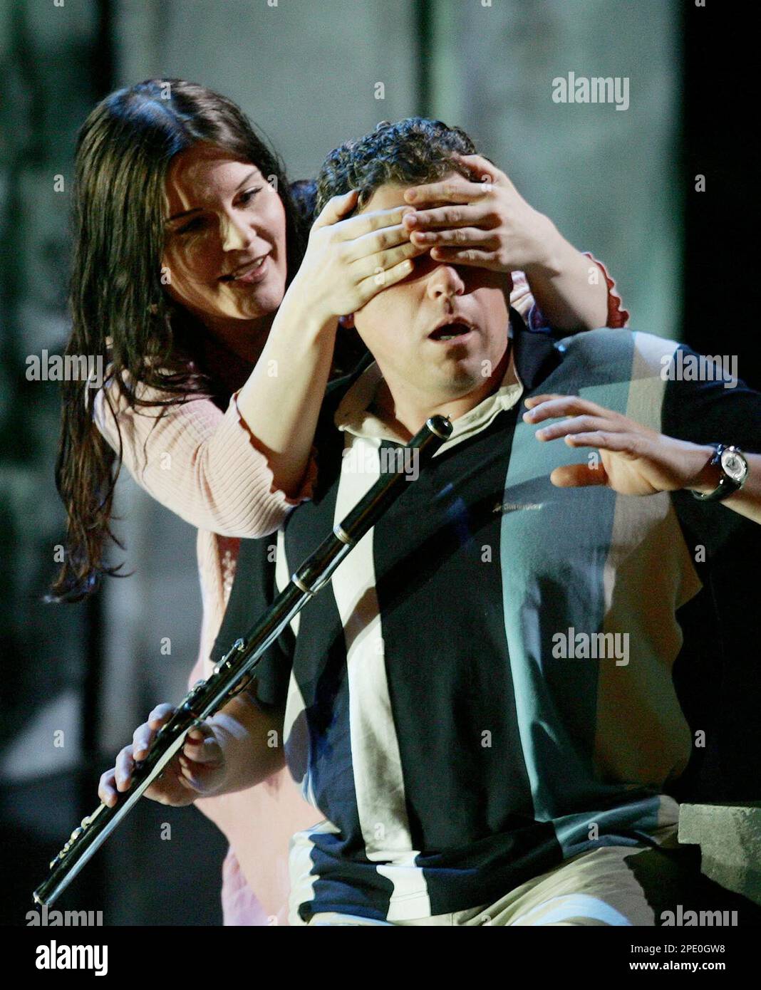 Genia Kuehmeier as Pamina and Michael Schade in the role of Tamino, from left, perform during a ...