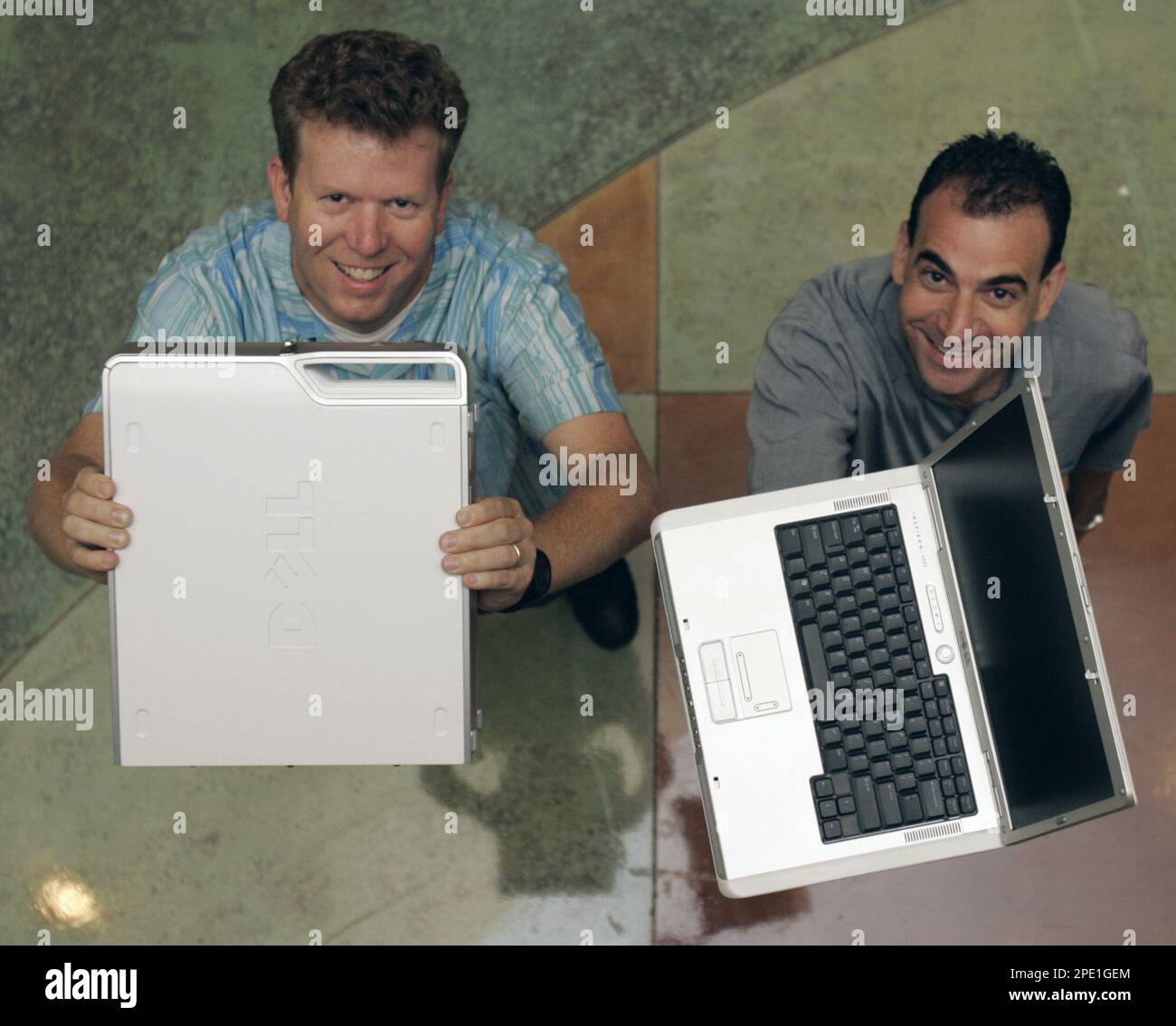 Ken Musgrave, left, and Steve Gluskoter display desktop and laptop ...