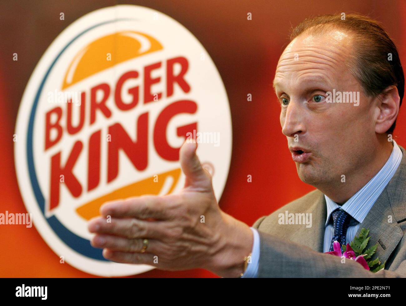 Greg Brenneman, chairman and CEO of the Burger King Corp. makes a ...