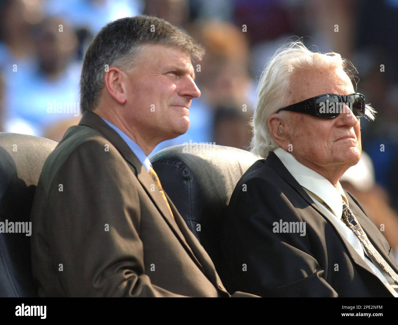 The Rev. Billy Graham, right, and his son Franklin listen to a speaker ...
