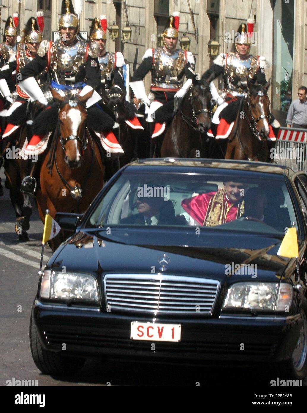 Pope Benedict XVI smiles as he sits in his car followed by Presidential ...