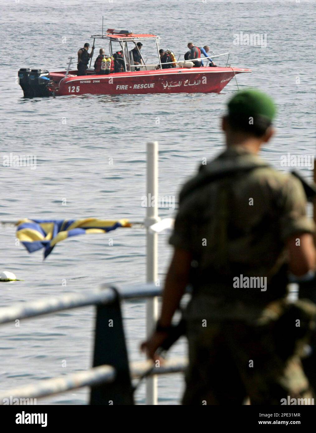A Lebanese army soldier stands guard as Lebanese civil defense and U.N ...