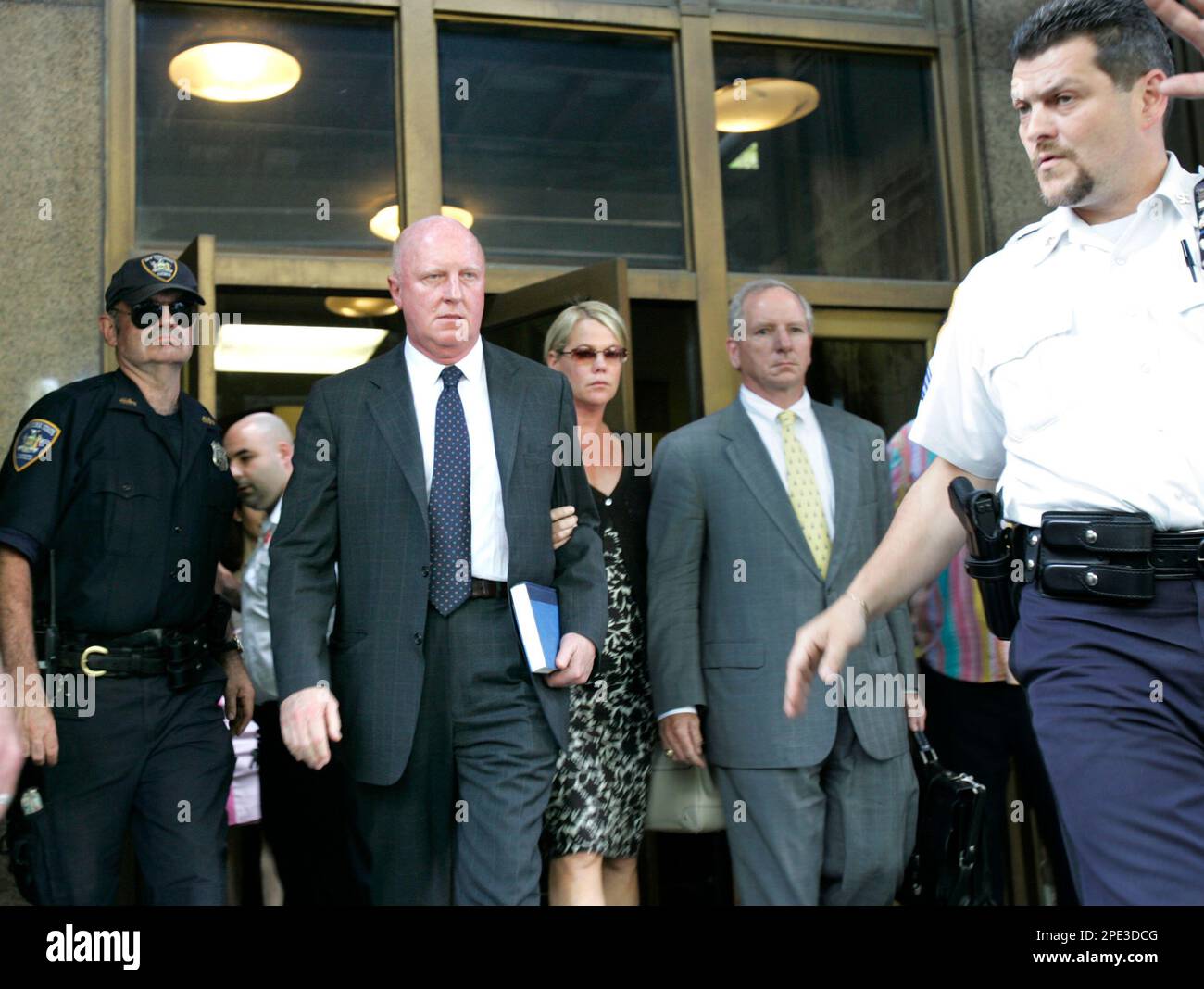 Former Tyco CEO L. Dennis Kozlowski, center, leaves court with his wife ...