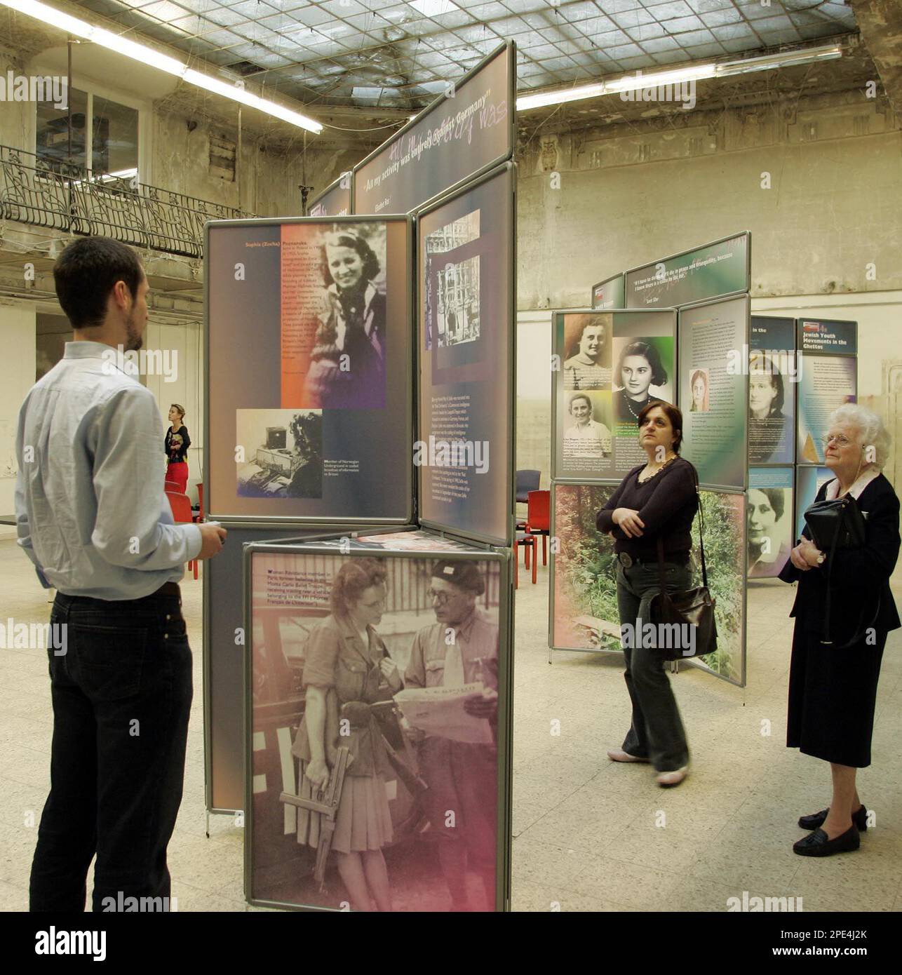 Visitors read on panels during the opening of an exhibition on women ...