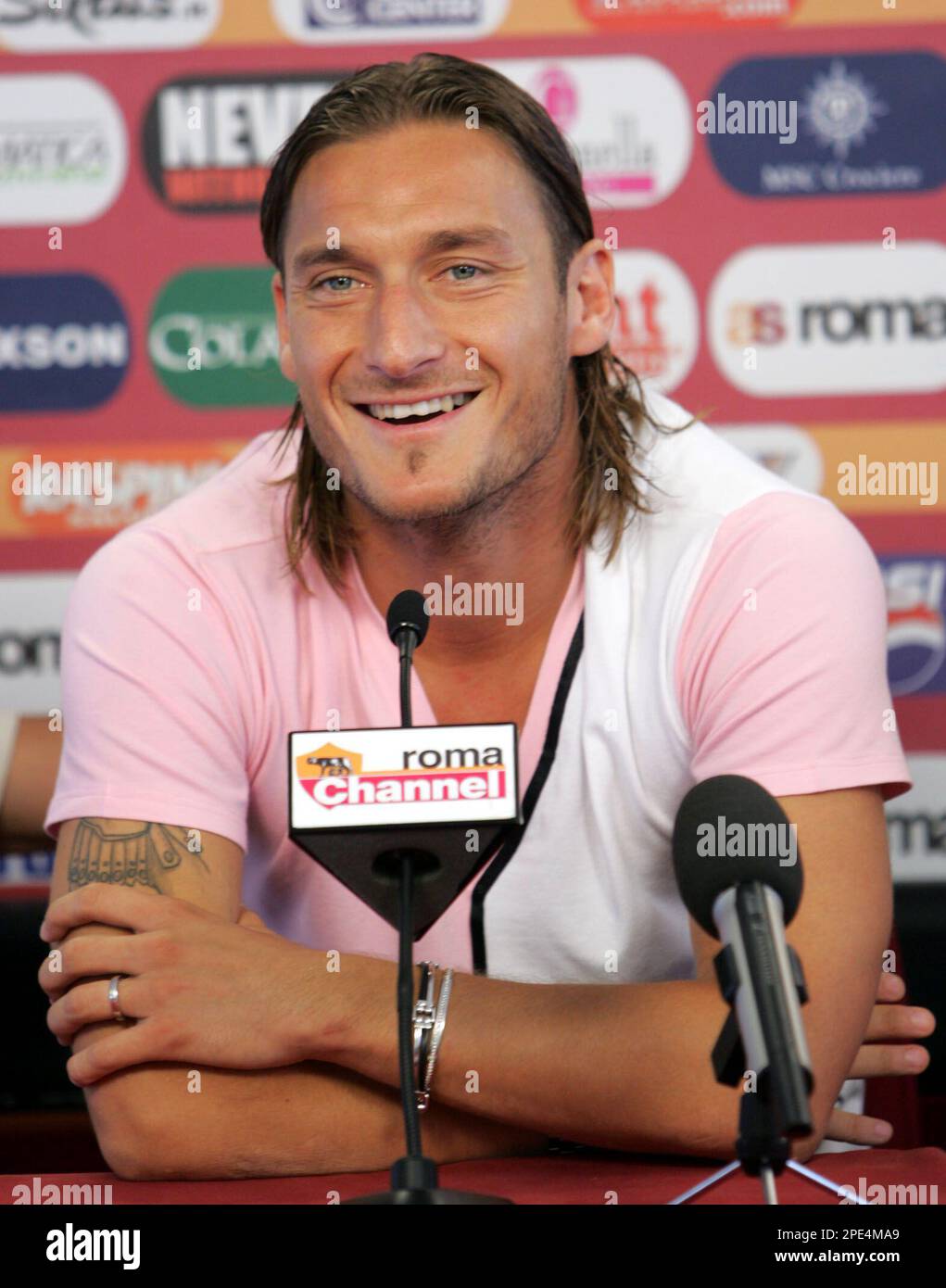 AS Roma soccer team striker Francesco Totti smiles as he answers ...