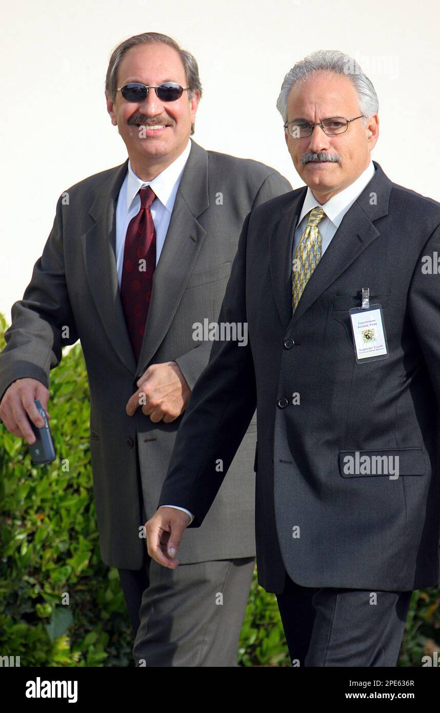 Michael Jackson's former attorney, Mark Geragos, left, is escorted to ...