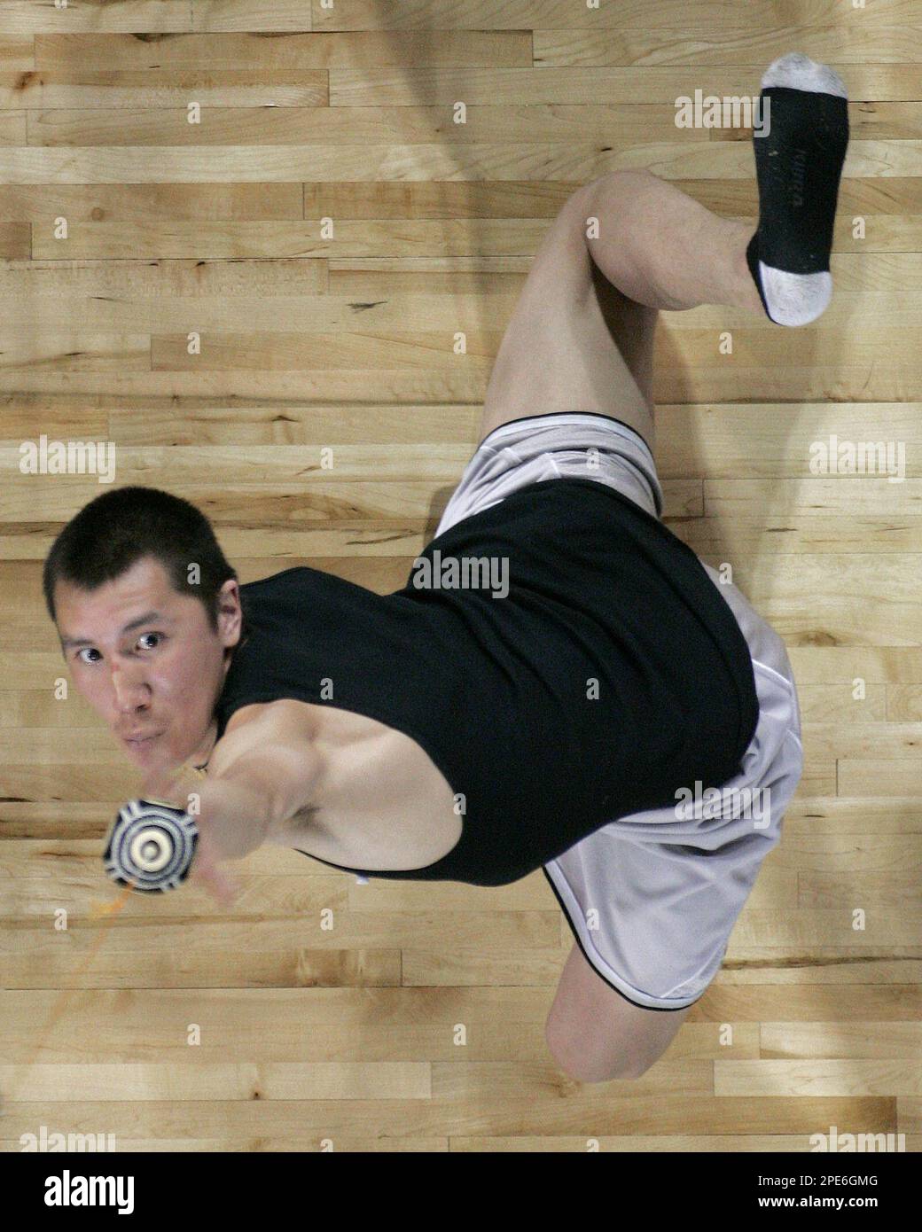 Billy Bodfish reaches for a skin ball hanging 66 inches off of the ...