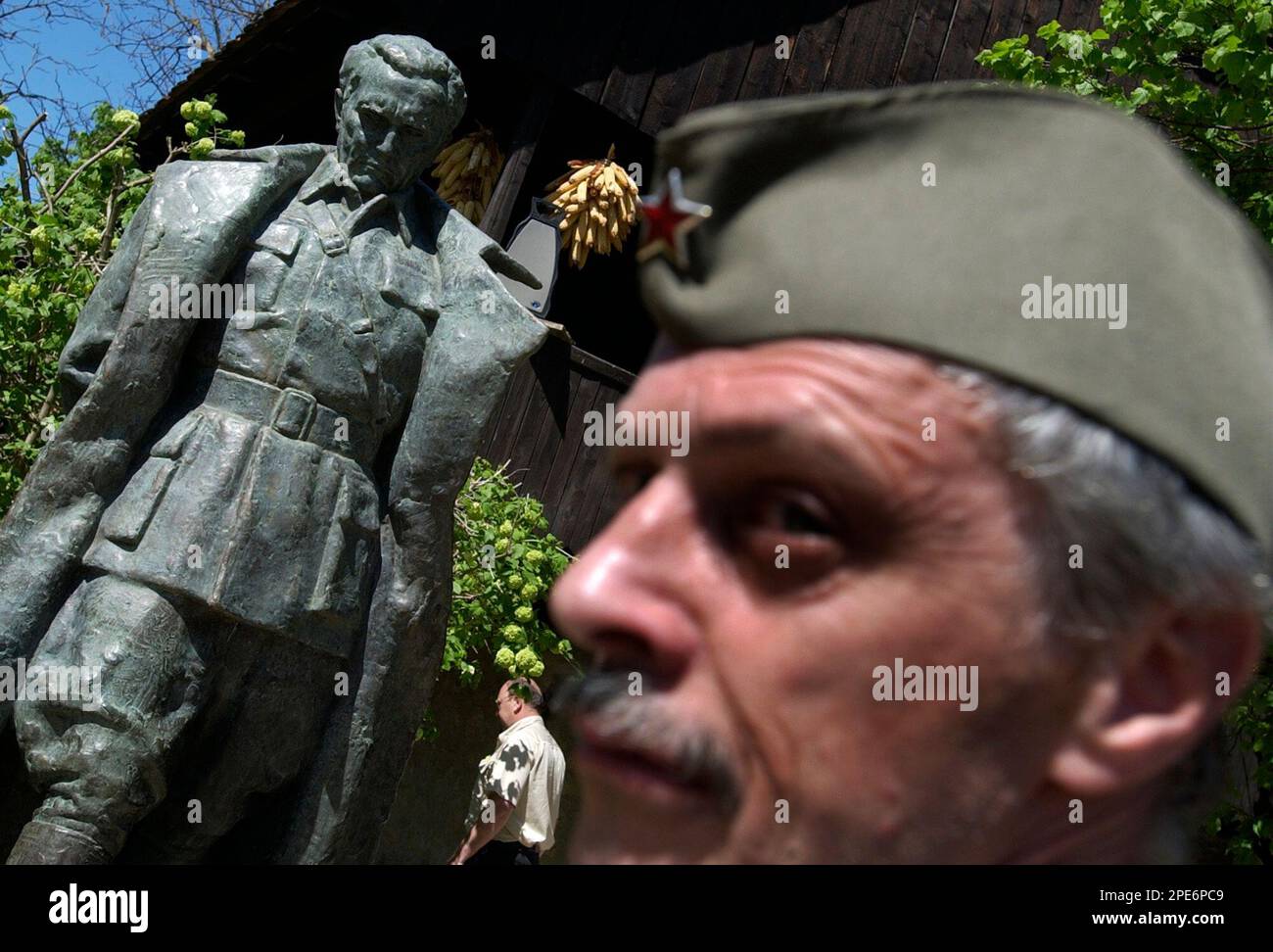 Slovene Franc Blatnik, wearing a partisan cap, stands in front of the ...