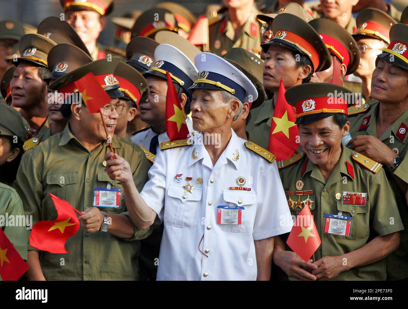 Vietnamese War veterans wave flags during celebrations of the 30th ...