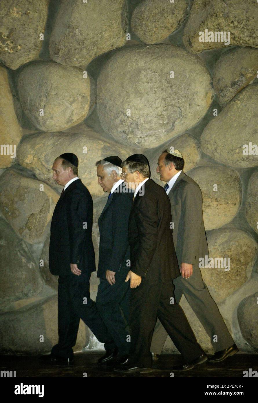 Russian President Vladimir Putin, left, is fllowed by Israeli President ...