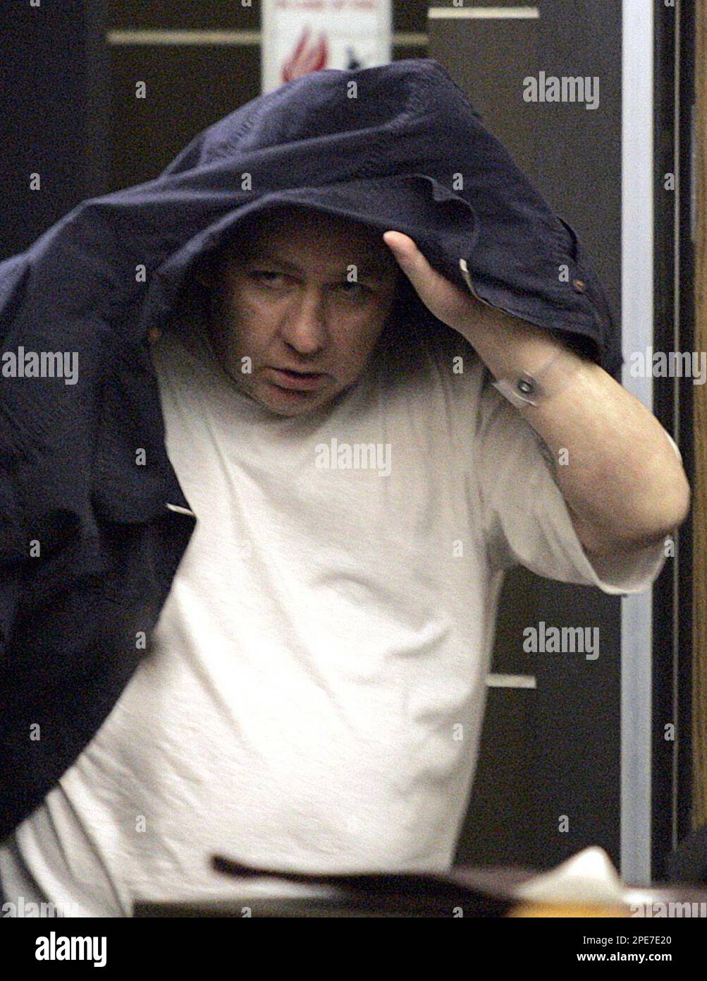 Fugitive Barry Joyce tries to cover his head in Middlesex Superior ...