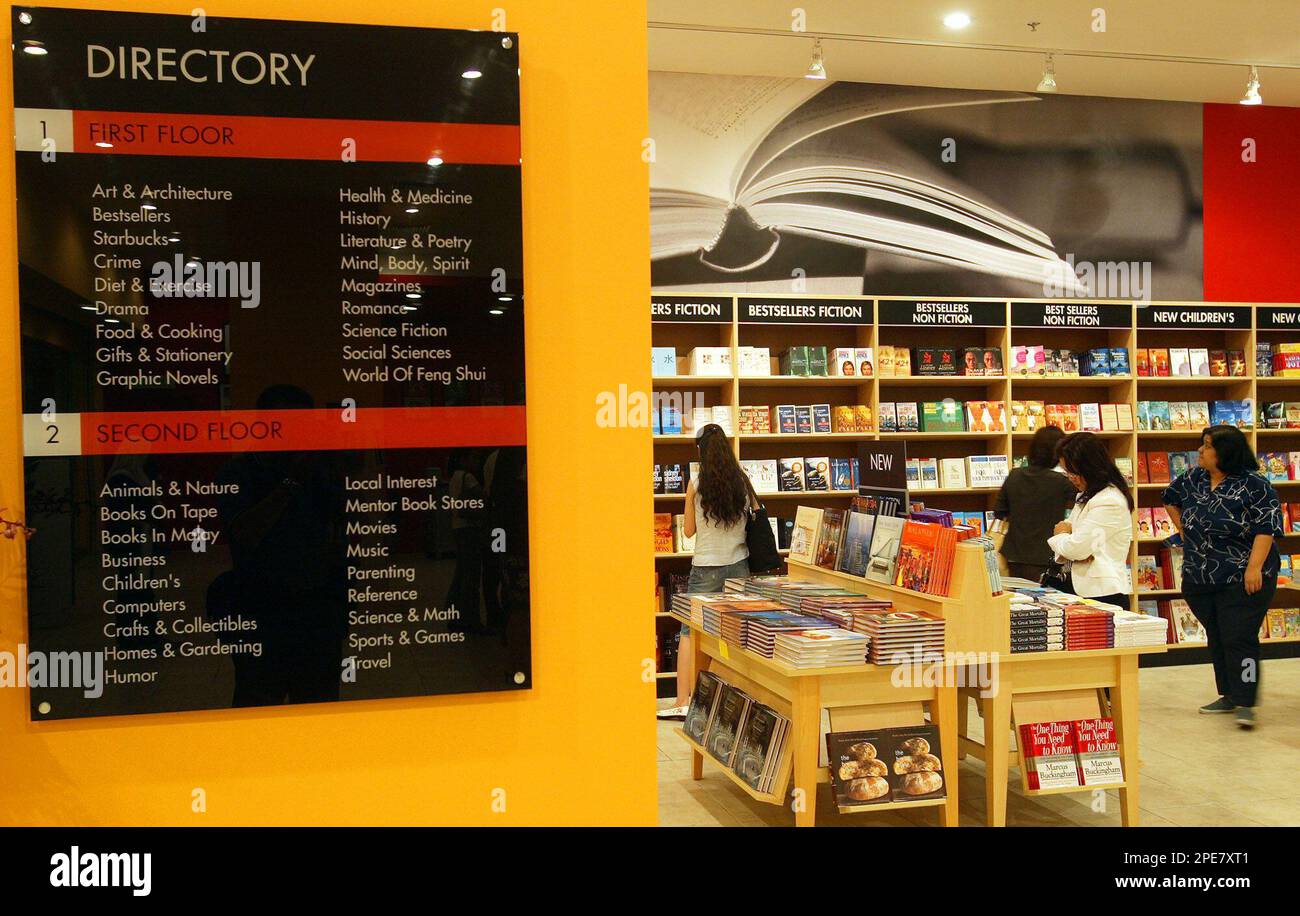 Shoppers views the books at the newly opened bookstore at a shopping ...