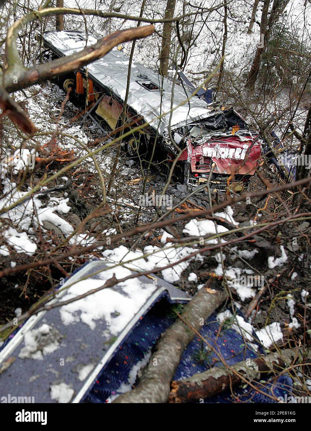 A Swiss tour bus lays on the bank of the Dranse river after an accident ...