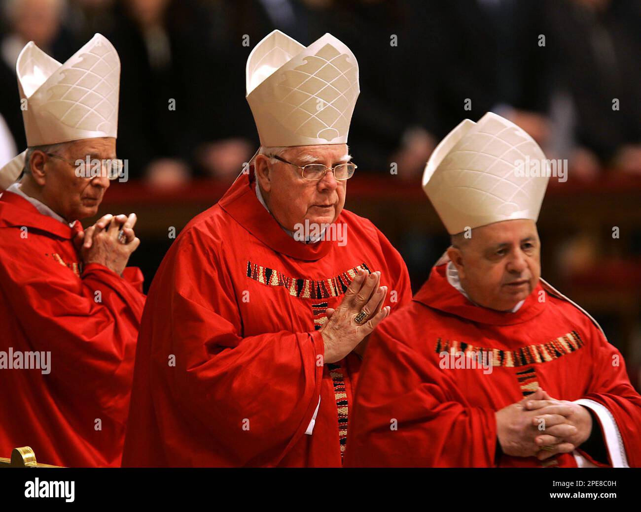 US Cardinal Bernard Law, center, follows Italian Cardinal Michele ...