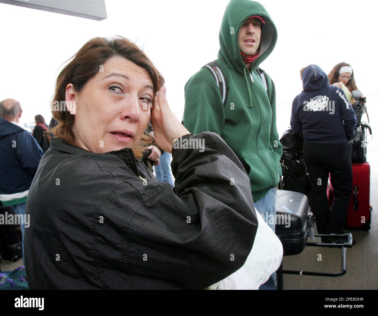 Debbie Morrison, of Oklahoma City, wipes tears from her eyes as she ...
