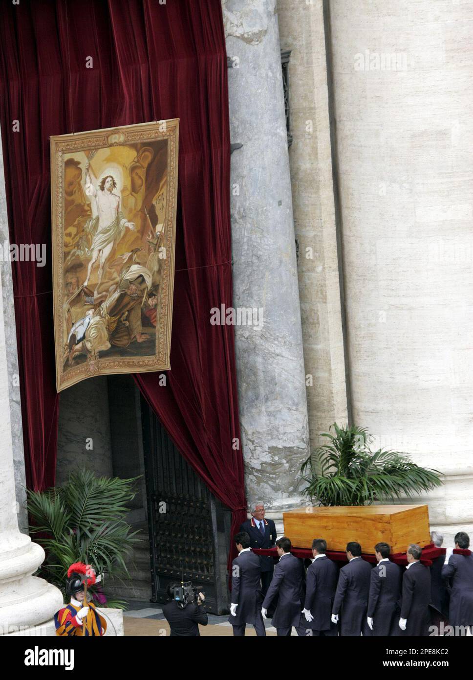 The coffin containing the body of Pope John Paul II is carried into St ...