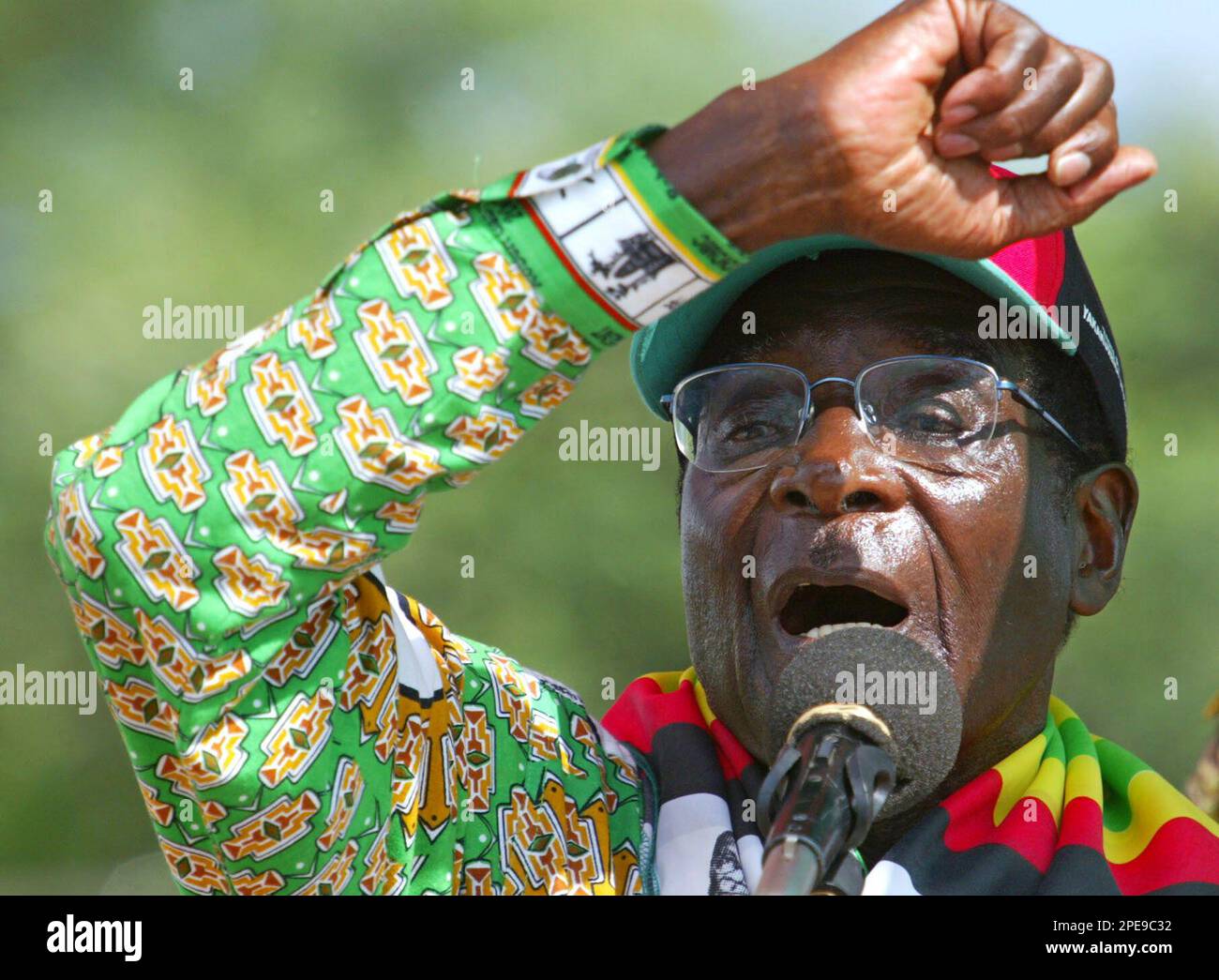 Zimbabwean President Robert Mugabe greets supporters of his ZANU-PF ...