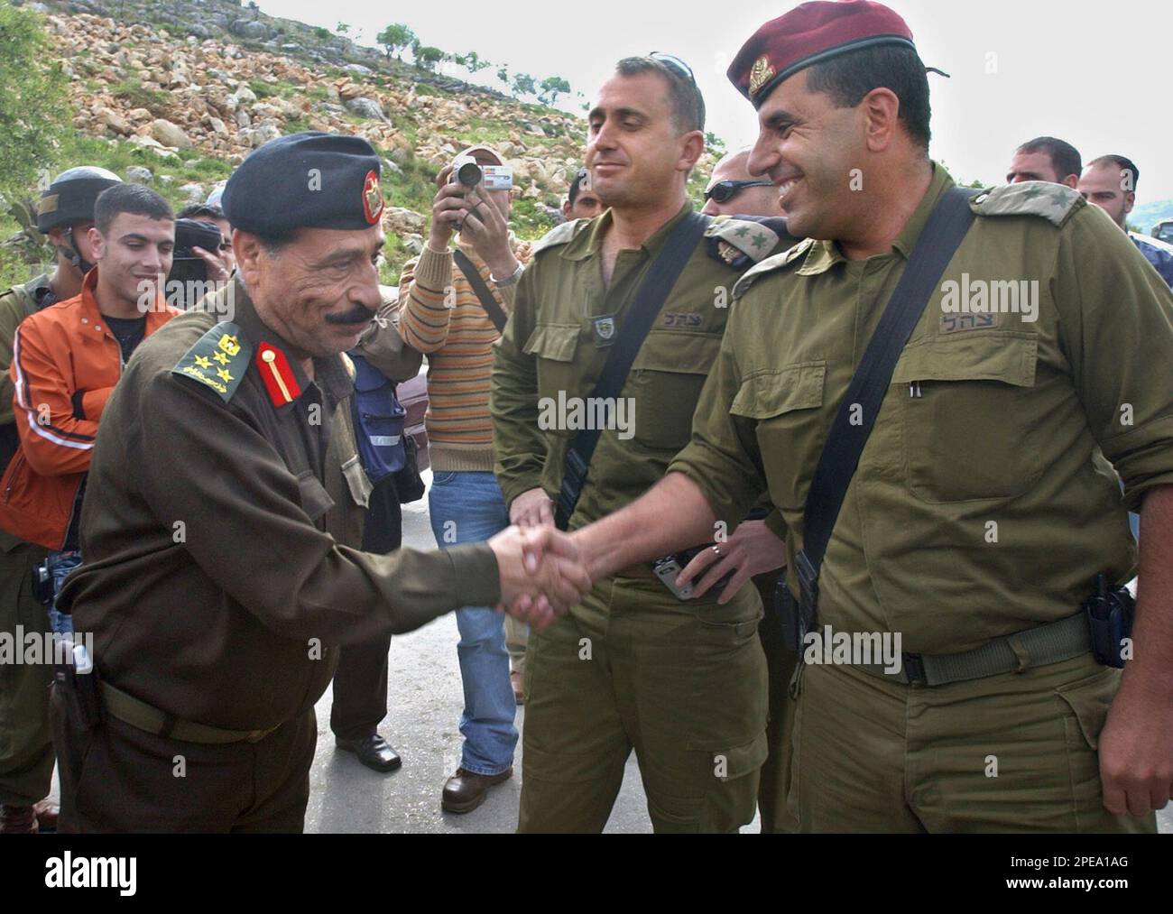 Palestinian police officer Said Abu Pasha, left, and Israeli Lieutenant ...