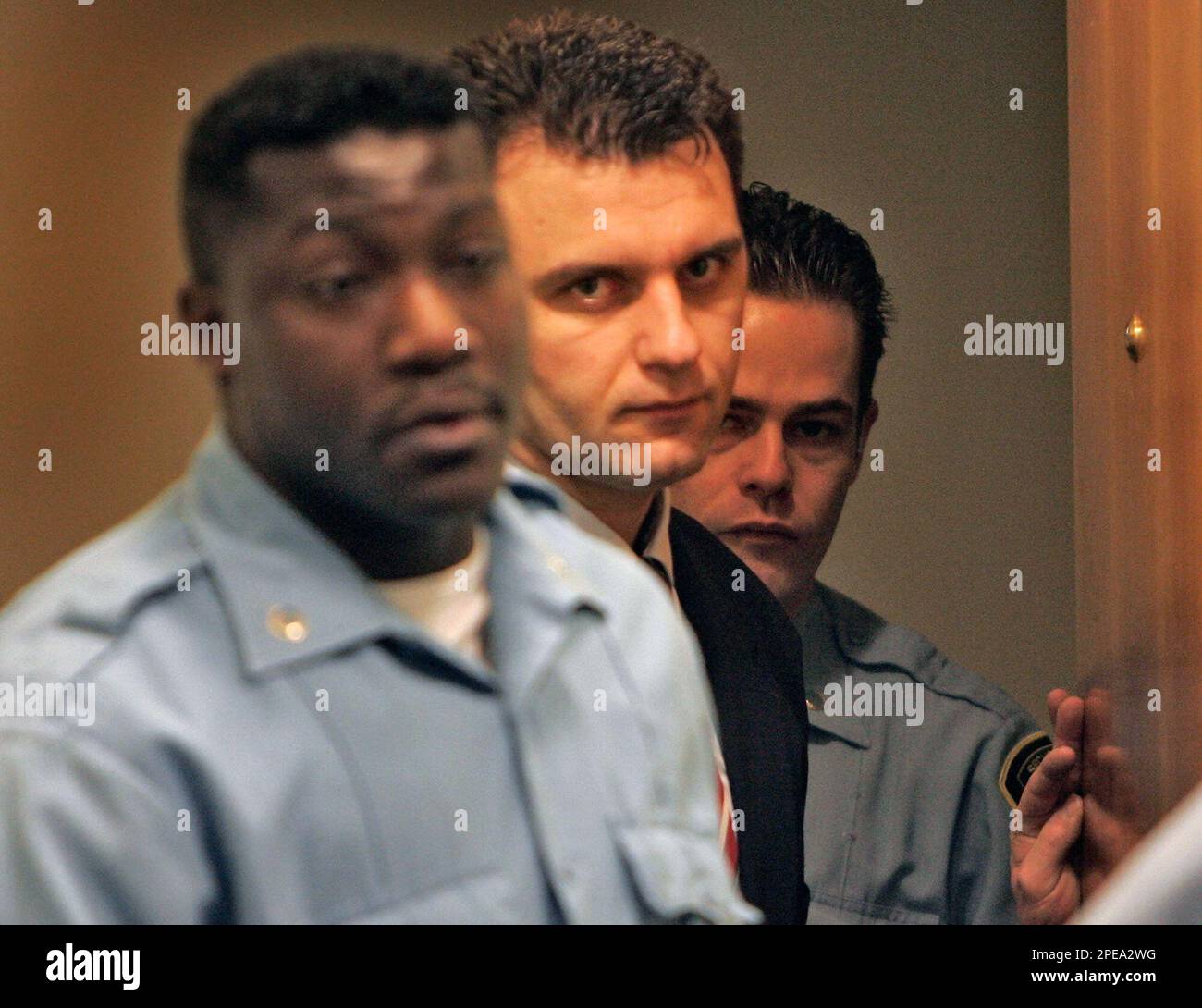 Former Macedonian police officer, Johan Tarculovsky, center, enters the ...