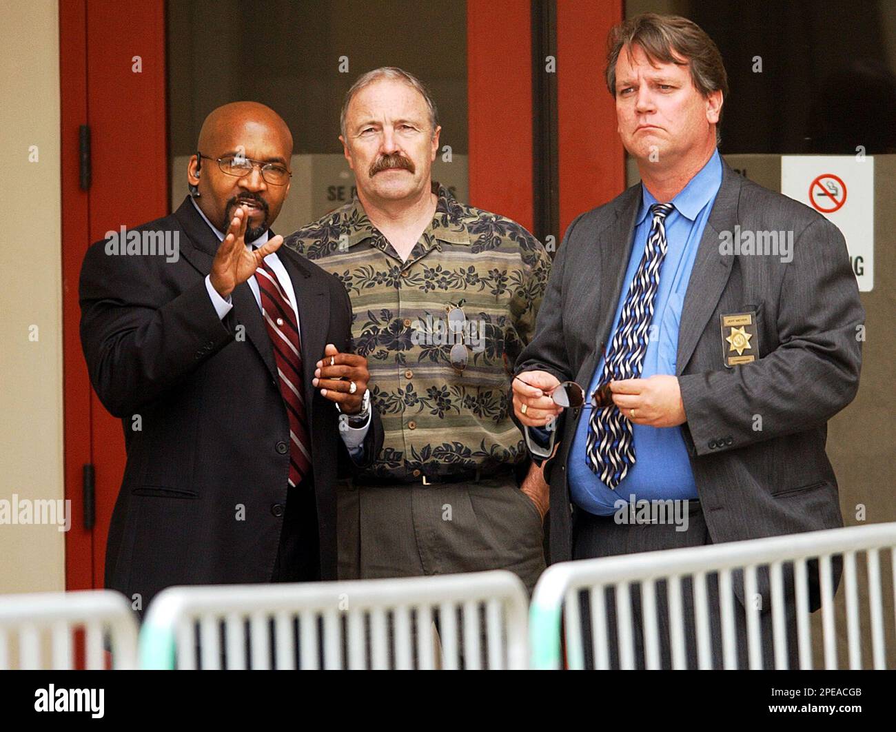 One of Michael Jackson's bodyguards, left, points out a suspicious ...
