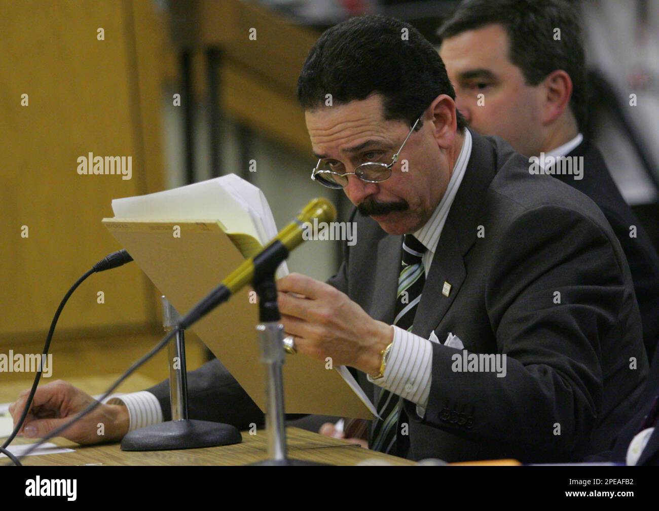 Sen. John Ford, D-Memphis, center, reads through the complaints filed ...
