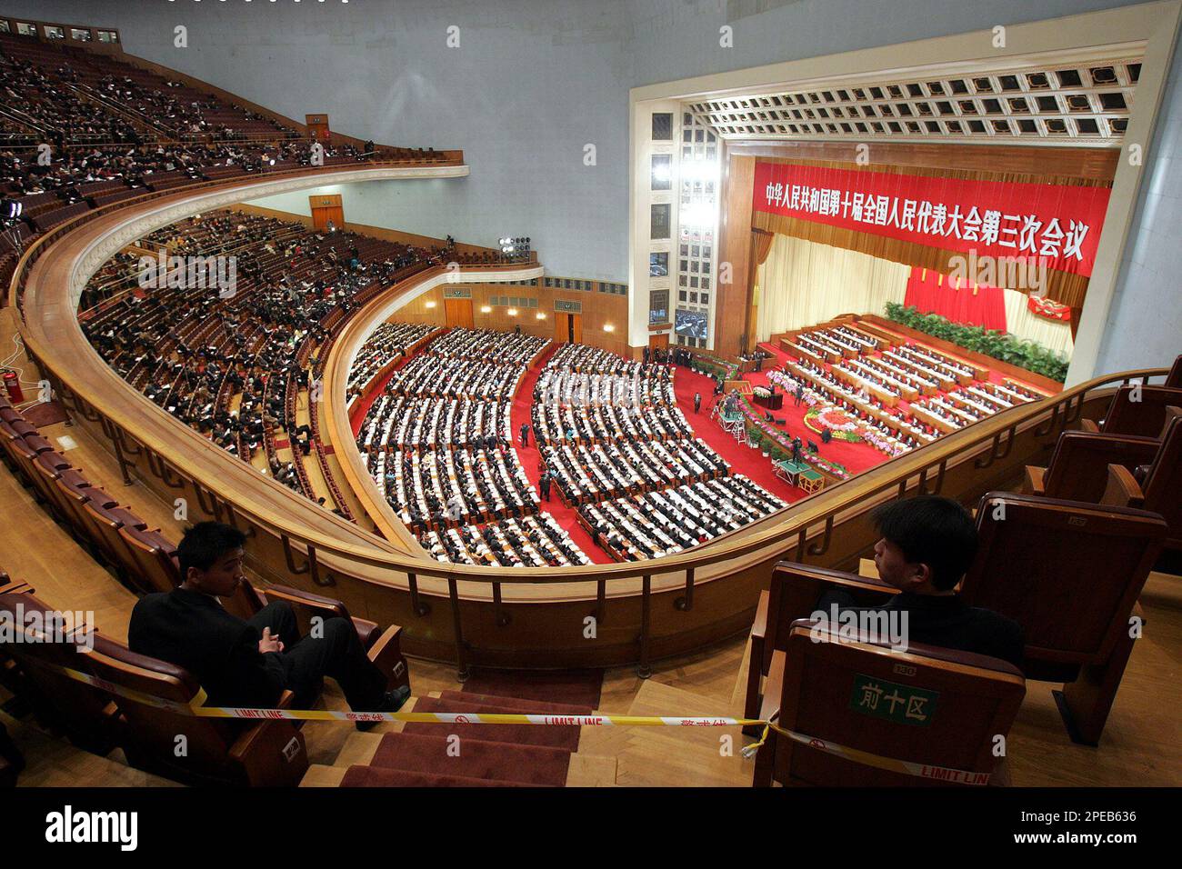 Chinese security on duty in the gallery as delegates attend a three ...