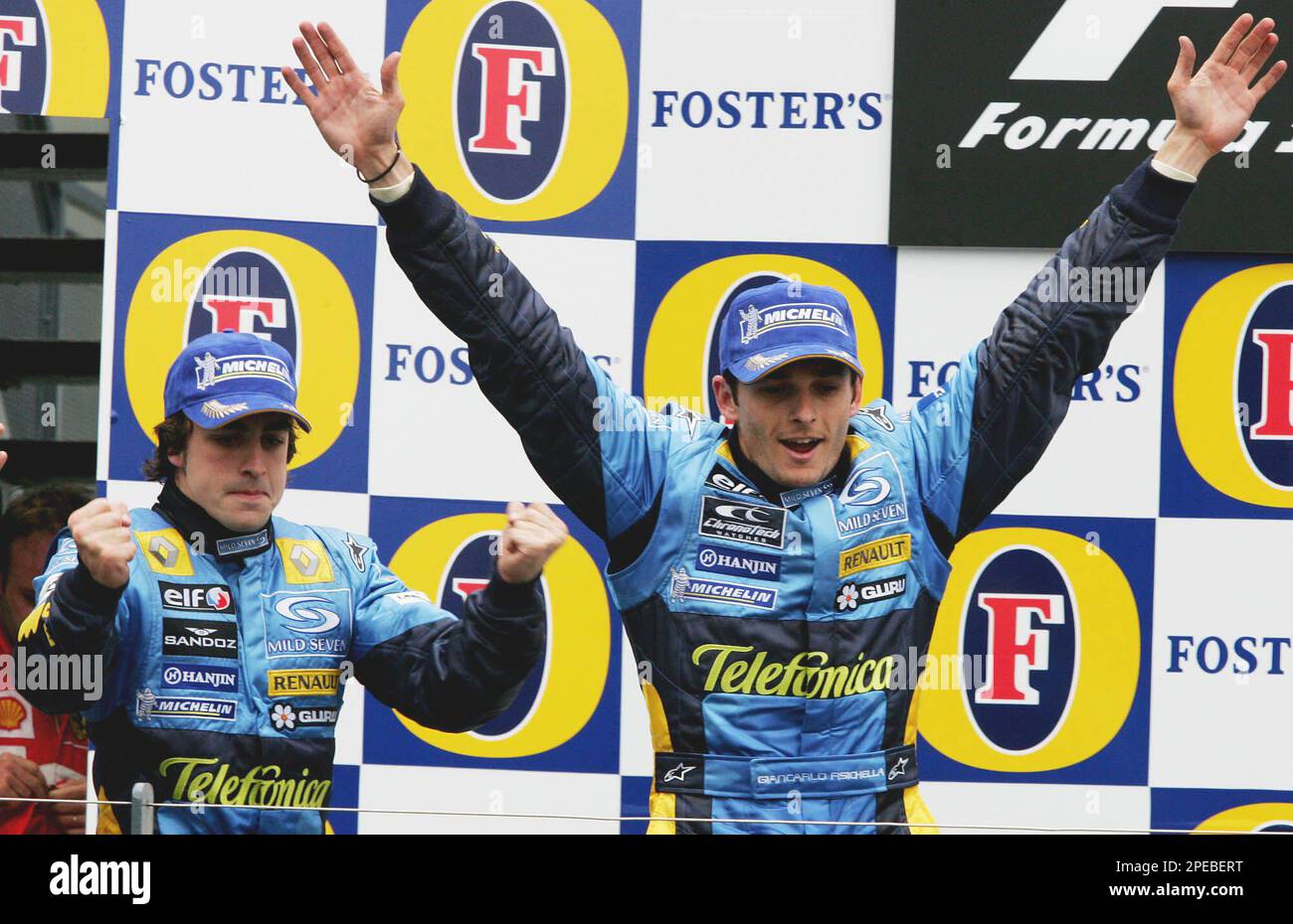Renault drivers Italy's Giancarlo Fisichella, right, and his teammate Fernando Alonso of Spain ...