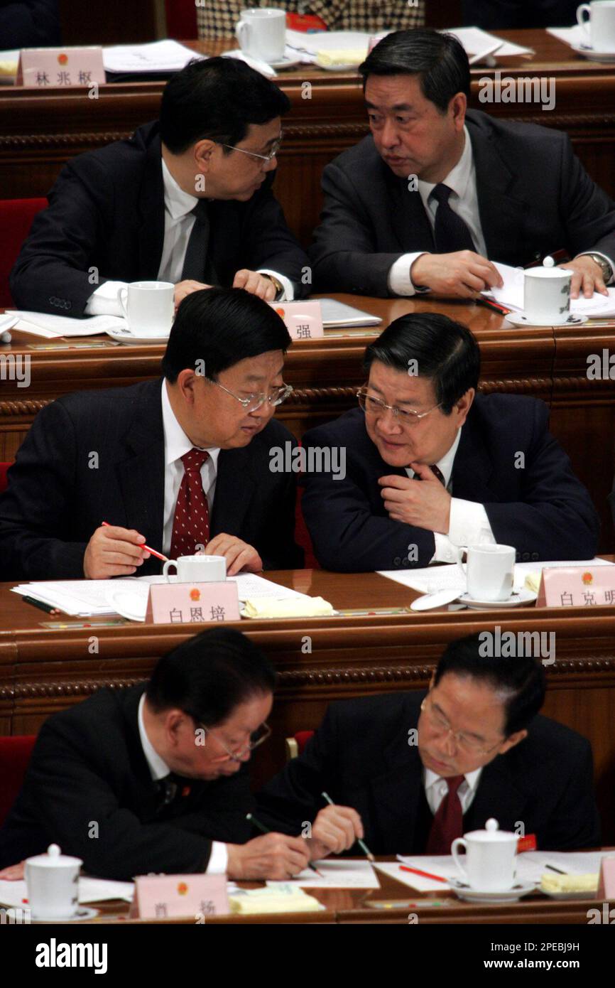 Chinese delegates are in discussion during the opening ceremony of the ...