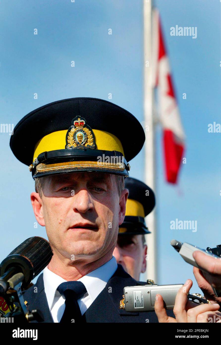 RCMP Western Alberta Superintendent Marty Cheliak speaks in front of a ...