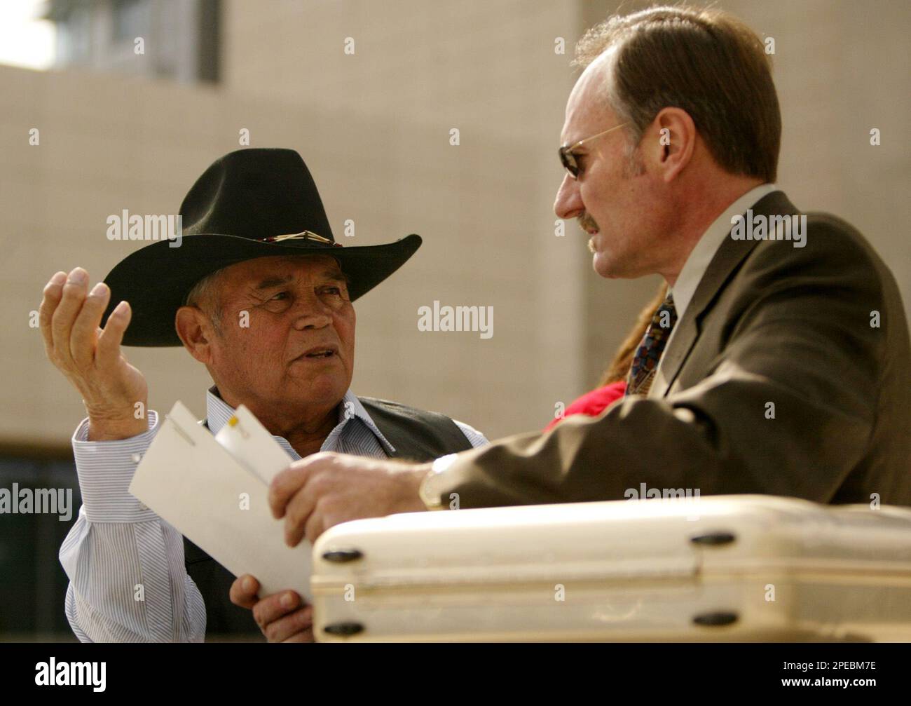 Chief Raymond Yowell of the Western Shoshone Nation, left, confers with ...