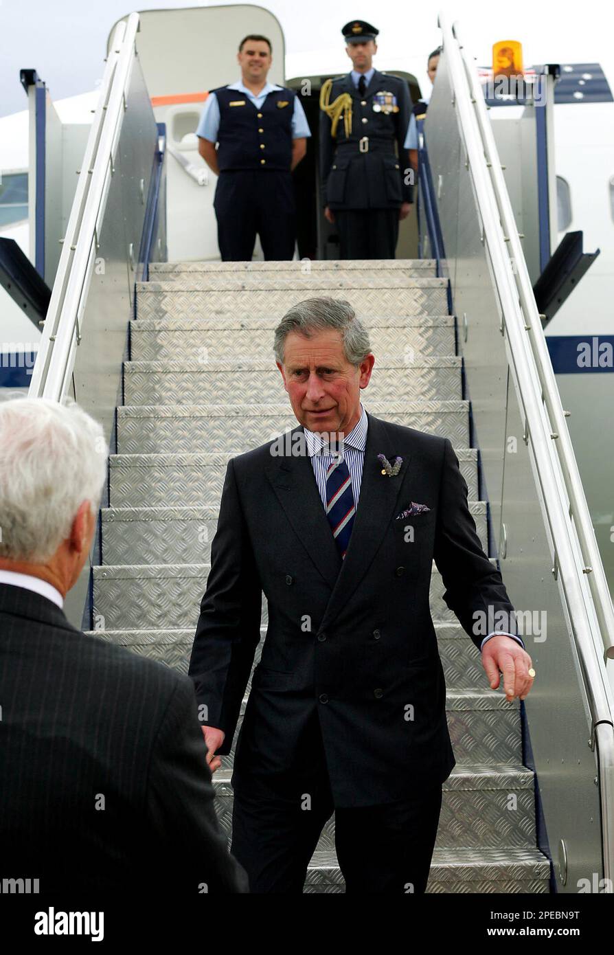 Britain's Prince Charles, center, is greeted by Australia's Governor ...