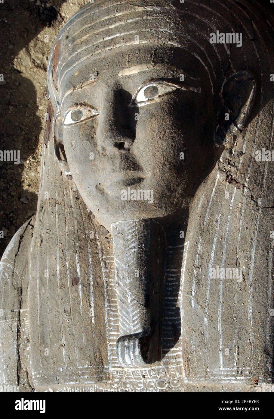 The face of an ancient wooden coffin, shaped like a human body that ...