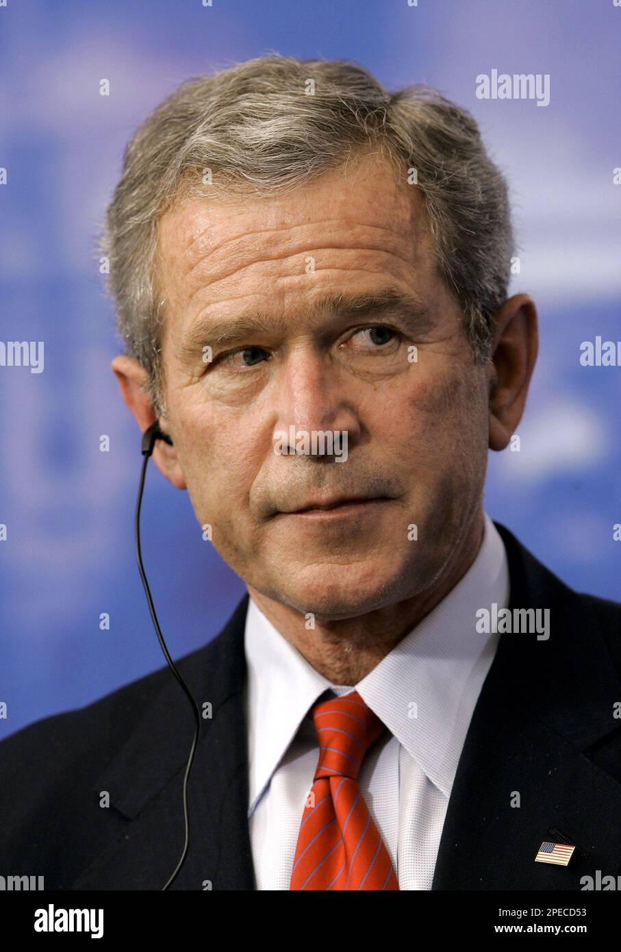 U.S. President George W. Bush pauses to listen to interpreted remarks ...