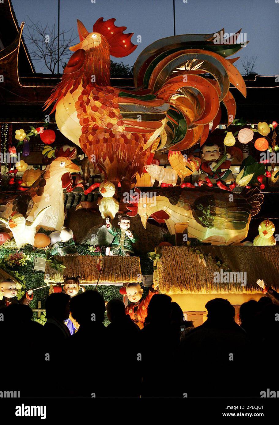 Visitors look at the lanterns depicting a rooster, Year of the Rooster ...