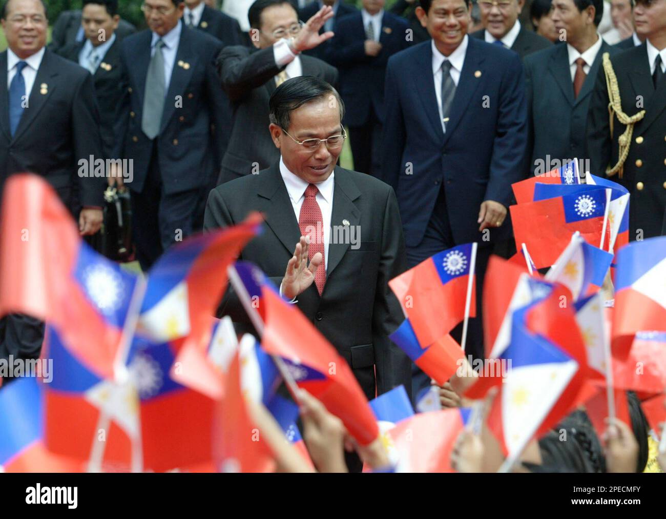 Visiting Prime Minister Lt. Gen. Soe Win of Myanmar, center, waves to ...