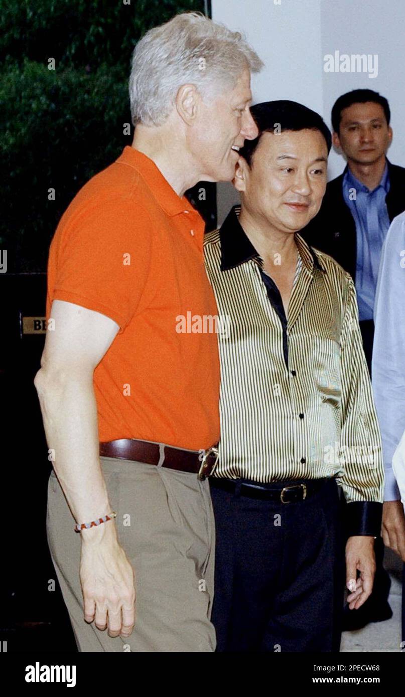Thailand Prime Minister Thaksin Shinawatra, right, greets former U.S. President Bill Clinton ...