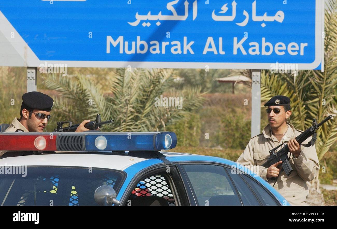 Kuwaiti policemen in Mubarak Al Kebir, south of Kuwait City on Monday ...
