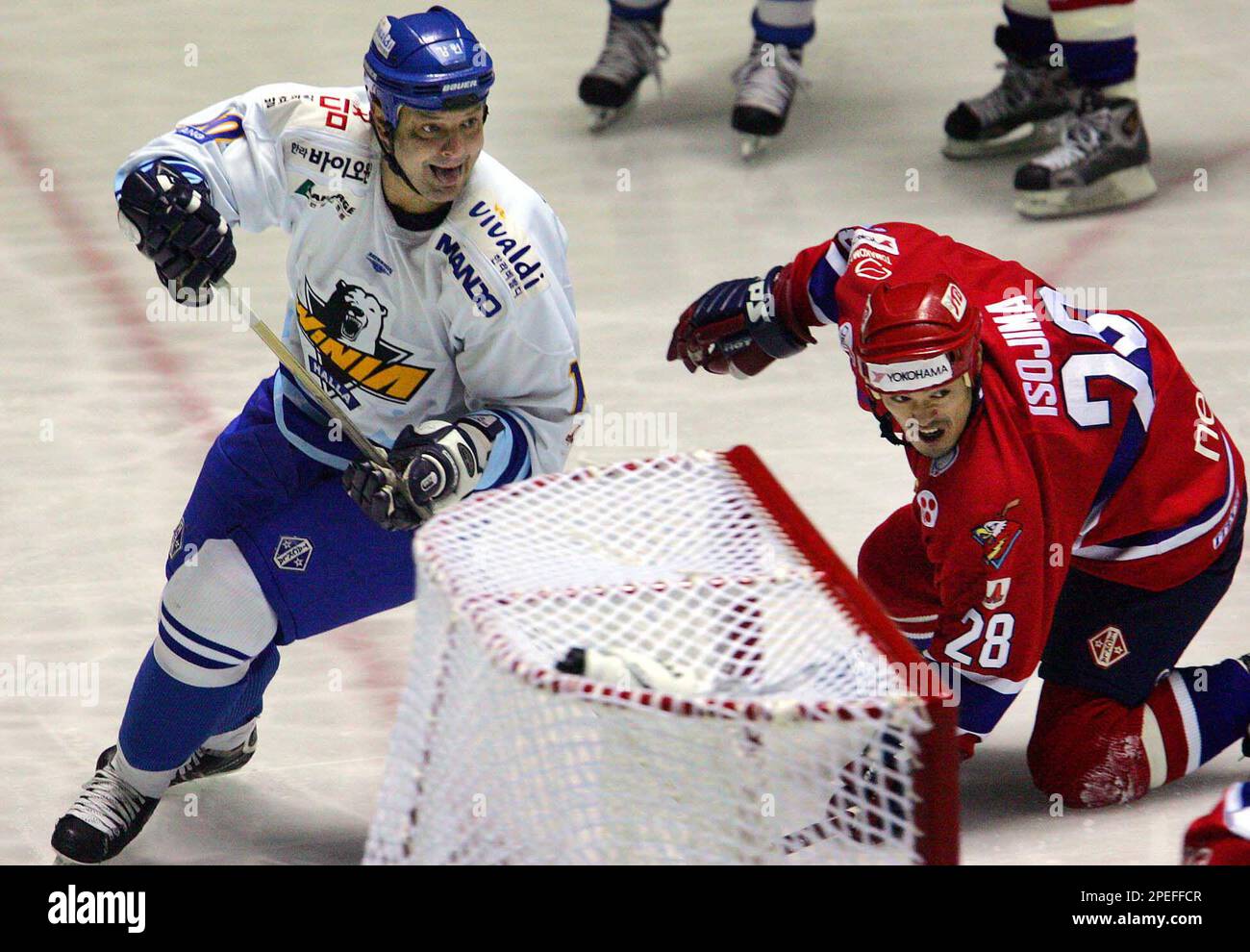 South Korean hockey team Halla's forward Esa Tikkanen, left, sticks his ...