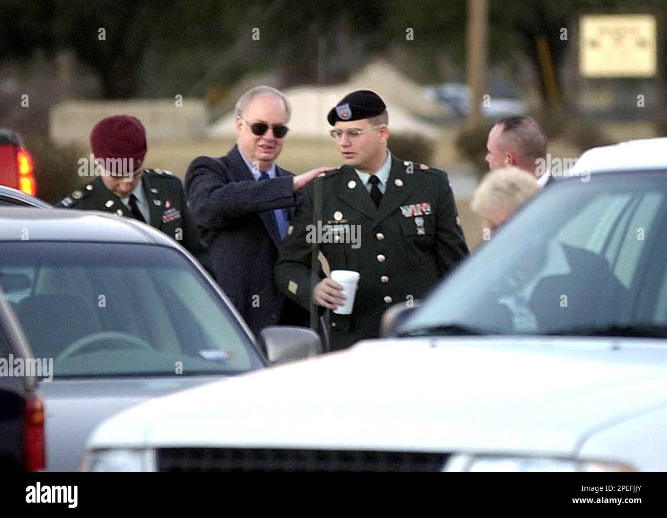 U.S. Army Spc. Charles Graner, right, gets a pat on the back from his ...