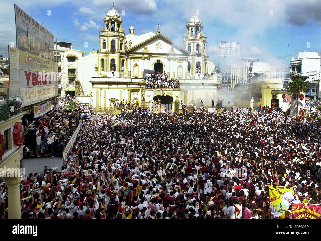 A big crowd of Filipino devotees cheer as the Black Nazarene, a ...