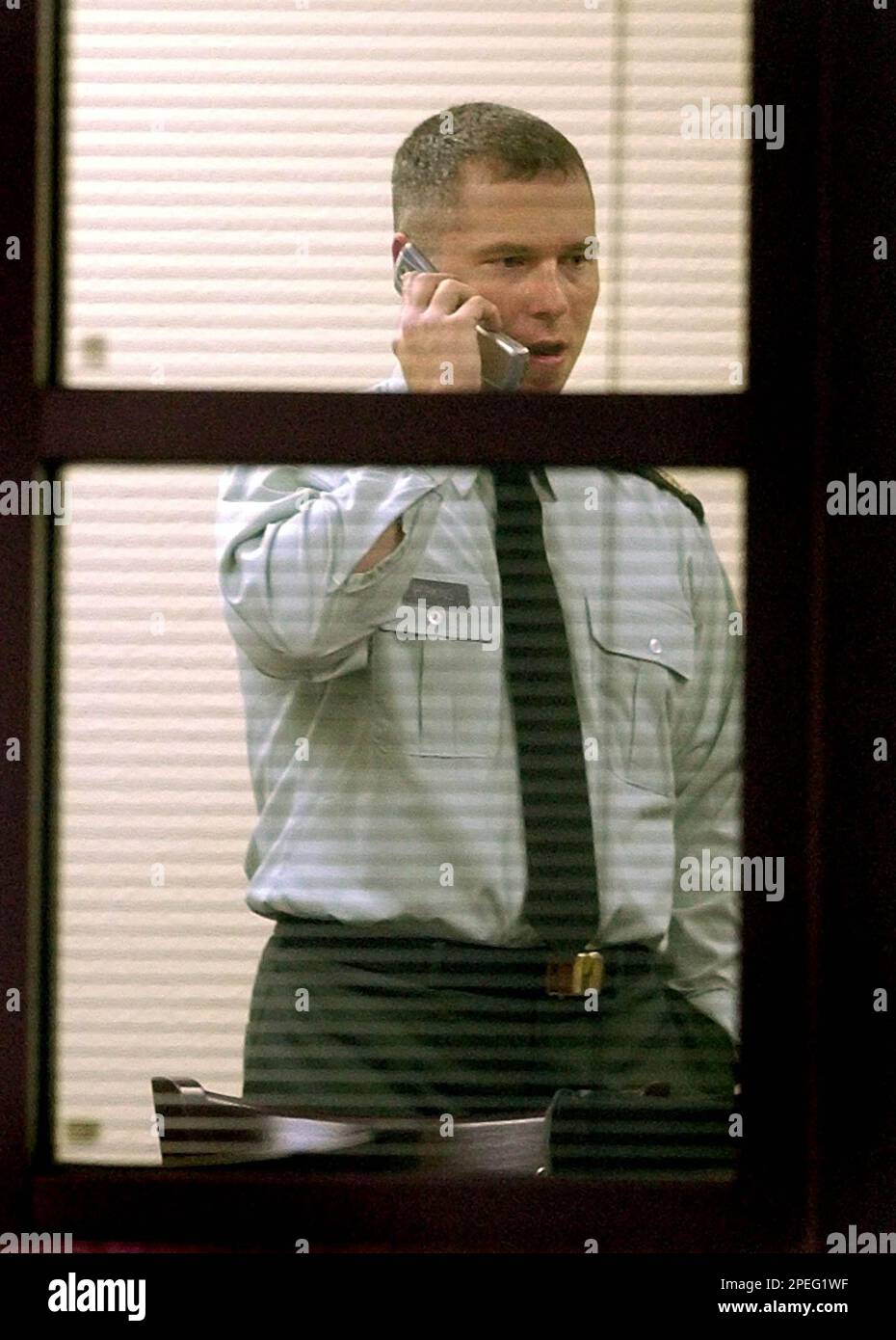 Army First Sgt. Tracy E. Perkins talks on a cell phone during an ...