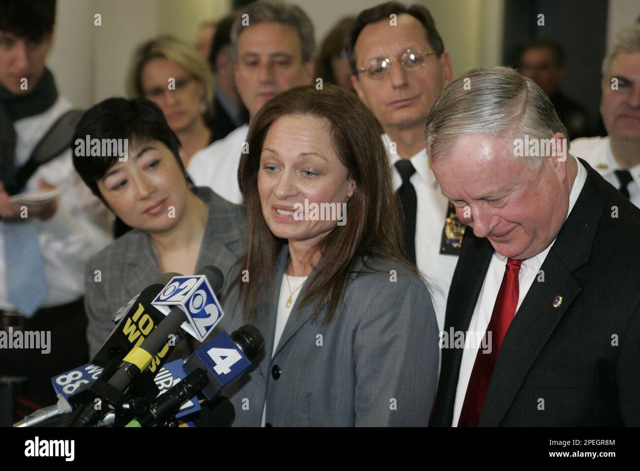 Suffolk County Assistant District Attorney Janet Albertson, center ...