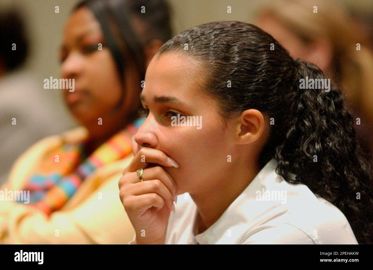 Keila Barros of Boston, cousin of Trina Persad, reacts Wednesday, Dec ...